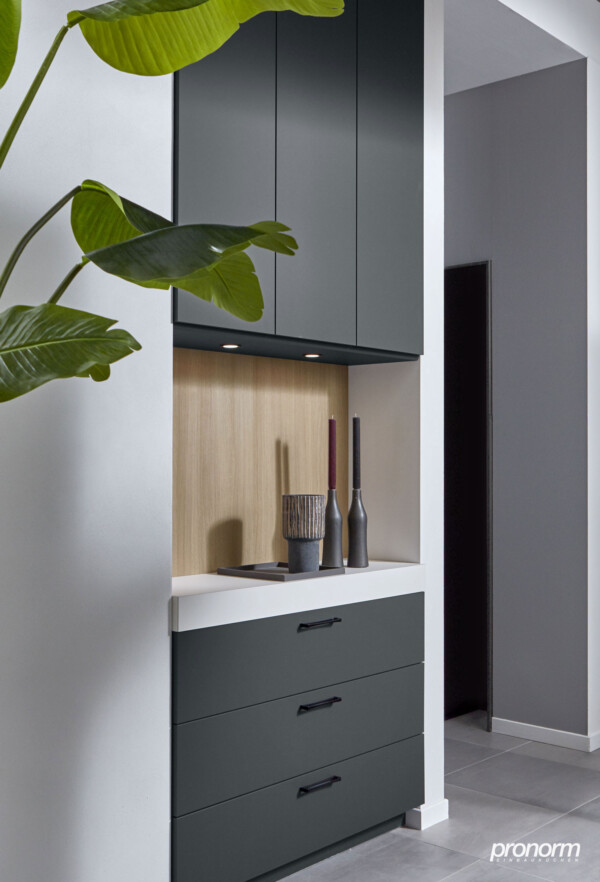 Small kitchen with kitchen island and seating area